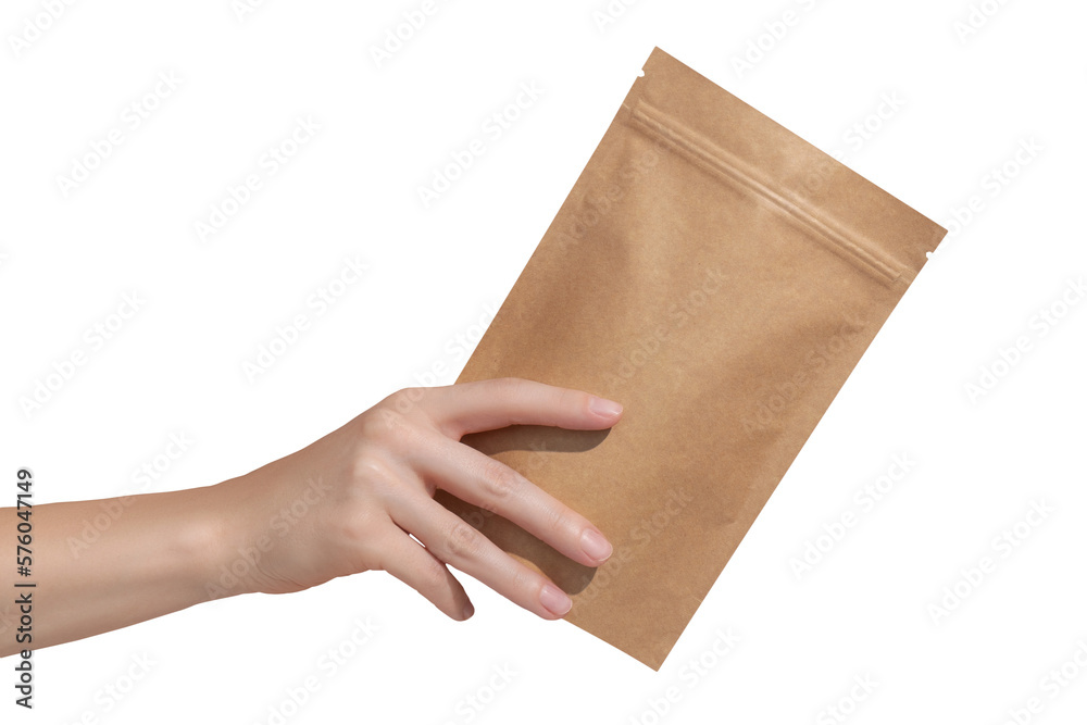 Woman's hands hold cardboard packages for tea or snacks on a ...