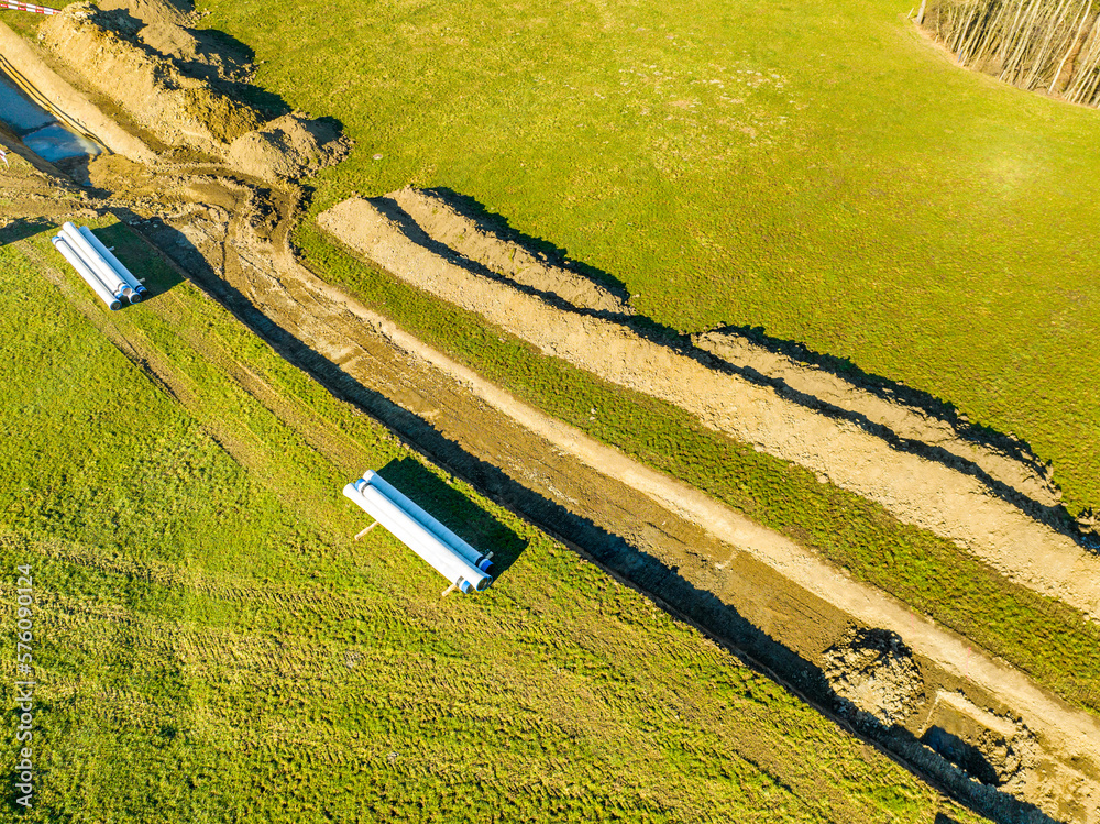 Plakát Aerial view of open trench construction site for pipe lining ...