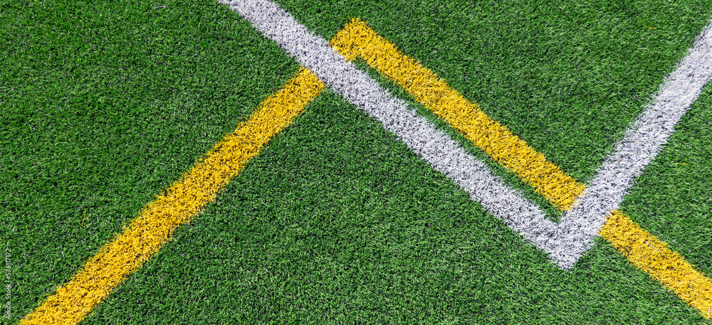 Green artificial grass turf soccer football field background with white ...