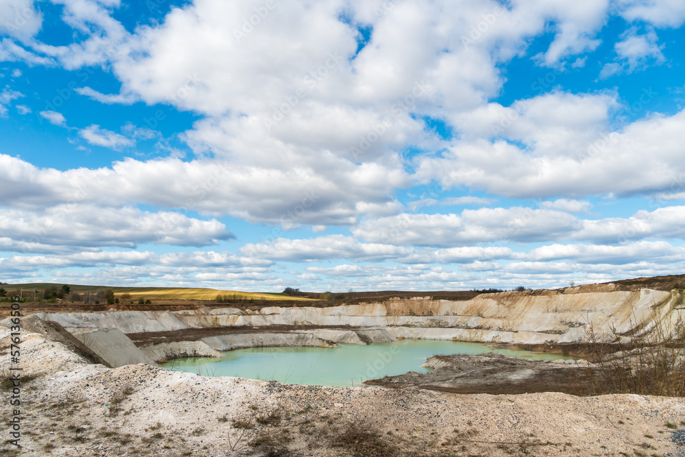A large sand quarry and a lake. A flooded old abandoned quarry complex ...