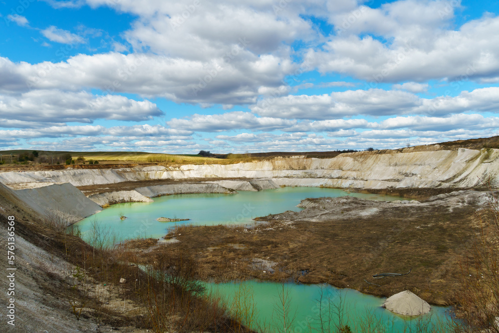A large sand quarry and a lake. A flooded old abandoned quarry complex ...