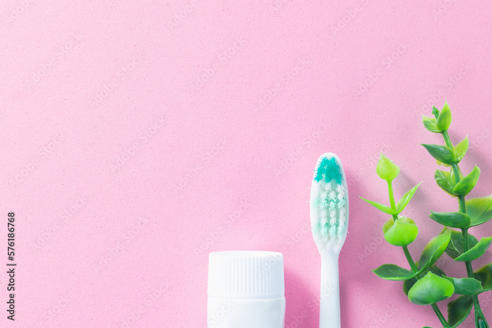 Pastel pink background with cleaning tools for oral and dental health ...