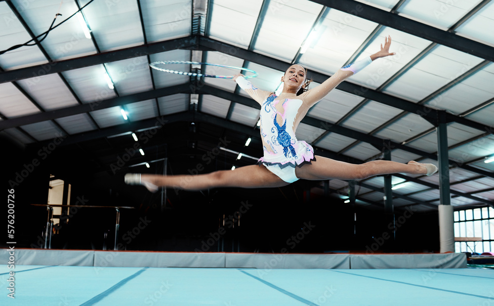 Gymnastics, woman athlete and performance at gym, fitness and leap ...