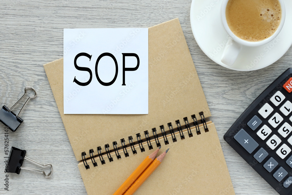 SOP - on sticker on notepad background, business concept SOP standard ...
