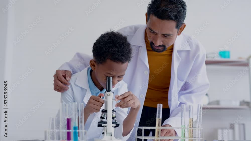 4K, Close-up schoolgirl's face, under microscope, In science class ...