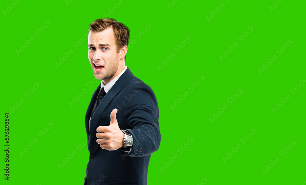 Excited businessman in black suit showing thumbs up like hand sign ...