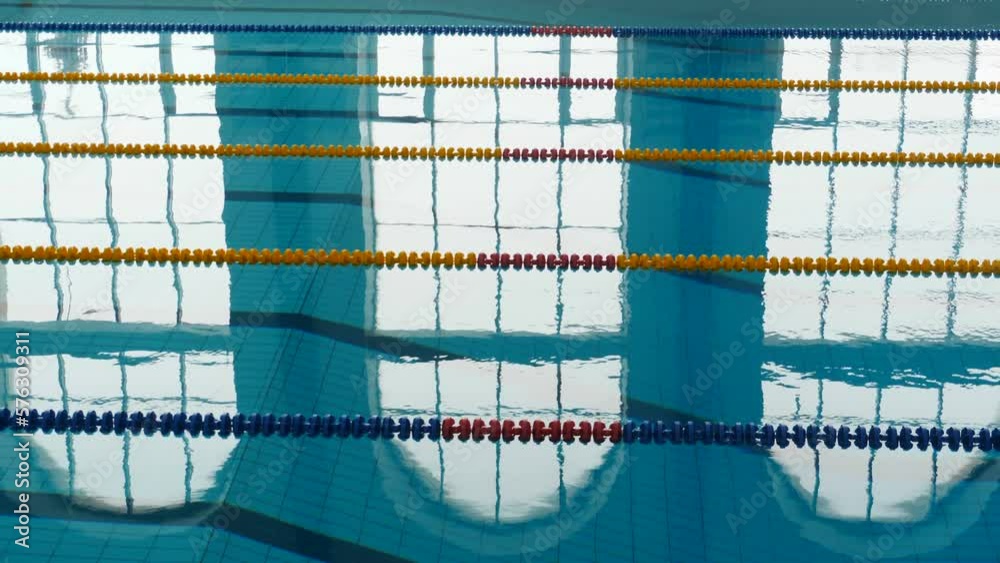 Empty professional pool. Empty pathes. Swimming pool with water and ...