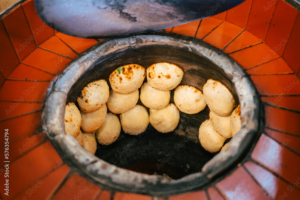 Fresh Hu Jiao Bing buns are baked in a hot oven. Traditional street ...