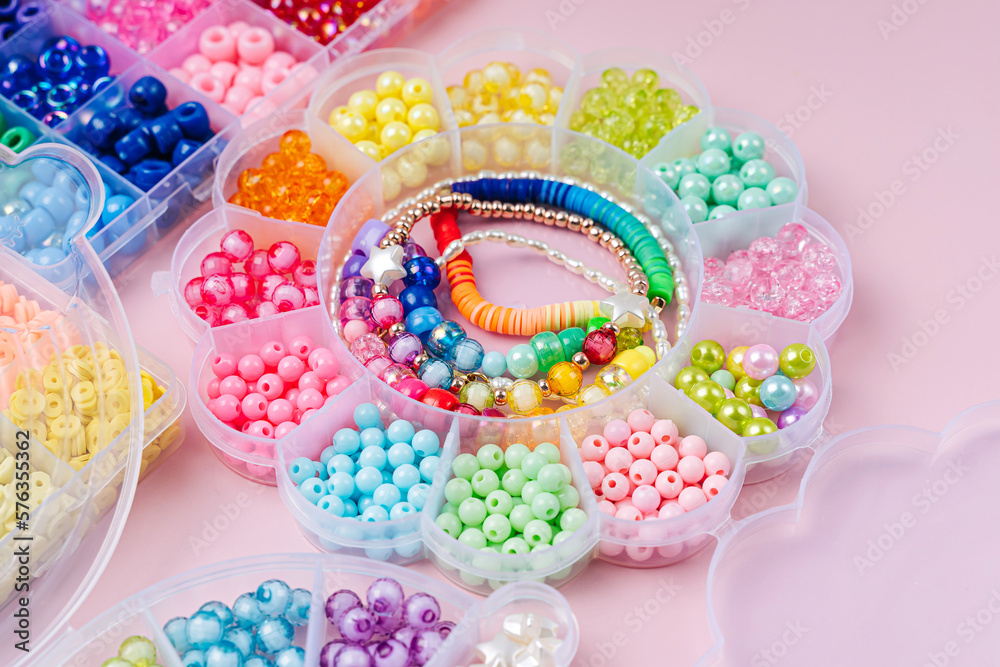 Kids handmade beaded jewelry and different multi-colored beads for ...