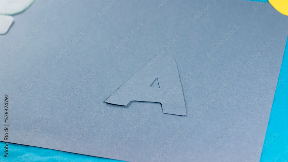 Letra A recortada en cartulina gris Stock Photo | Adobe Stock