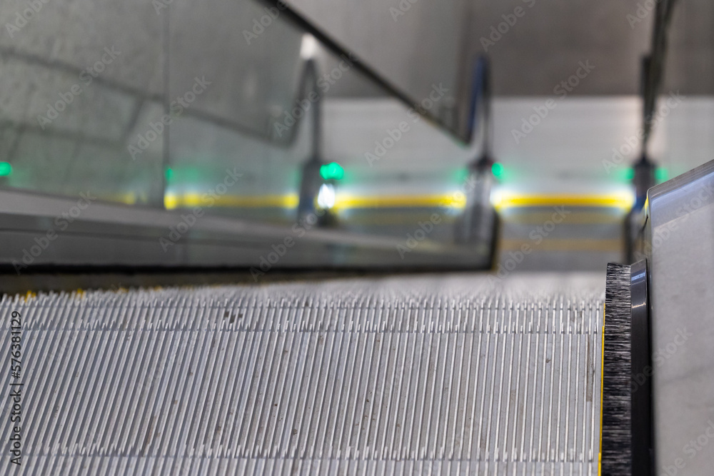 Escalators in an underground pedestrian passage. Close-up of steps ...