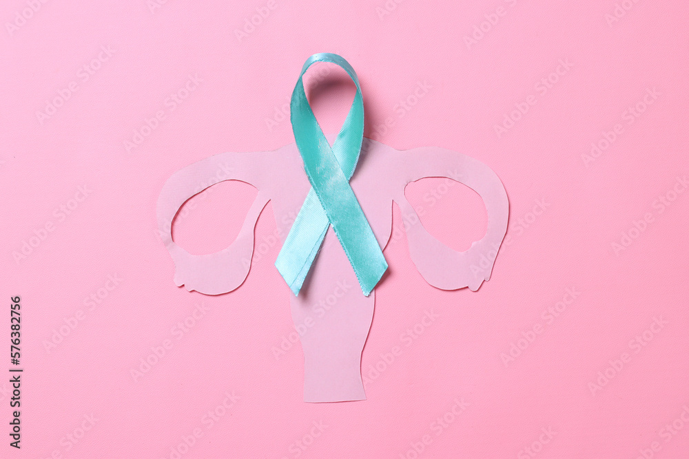 Teal awareness ribbon with cervix shape over pink background with copy ...