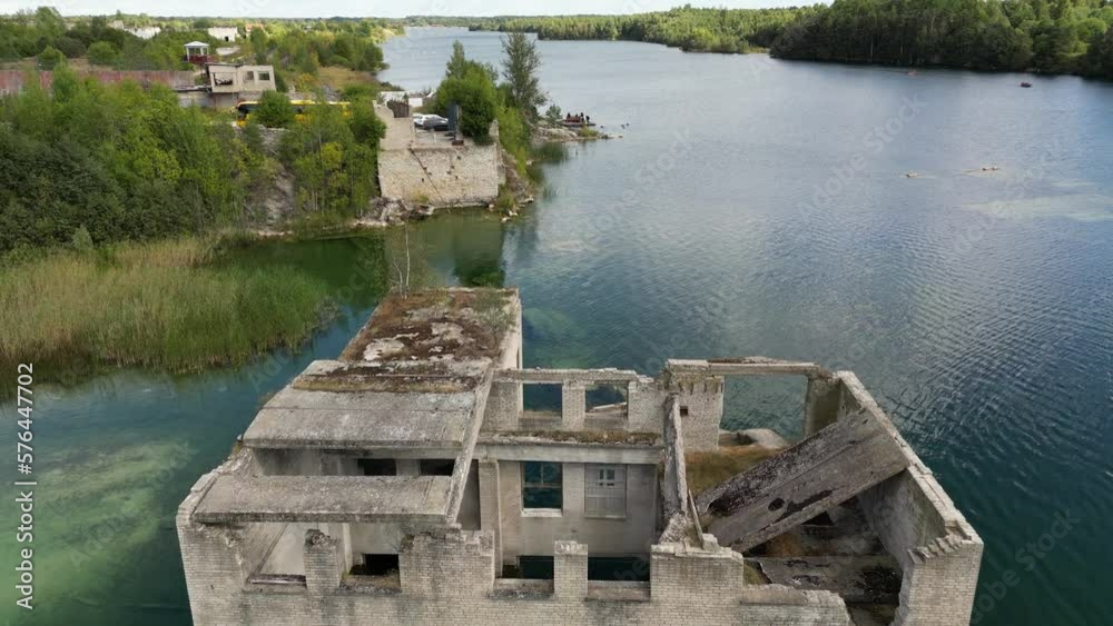 Village flooded and submerged underwater. Abandoned Rummu quarry ...