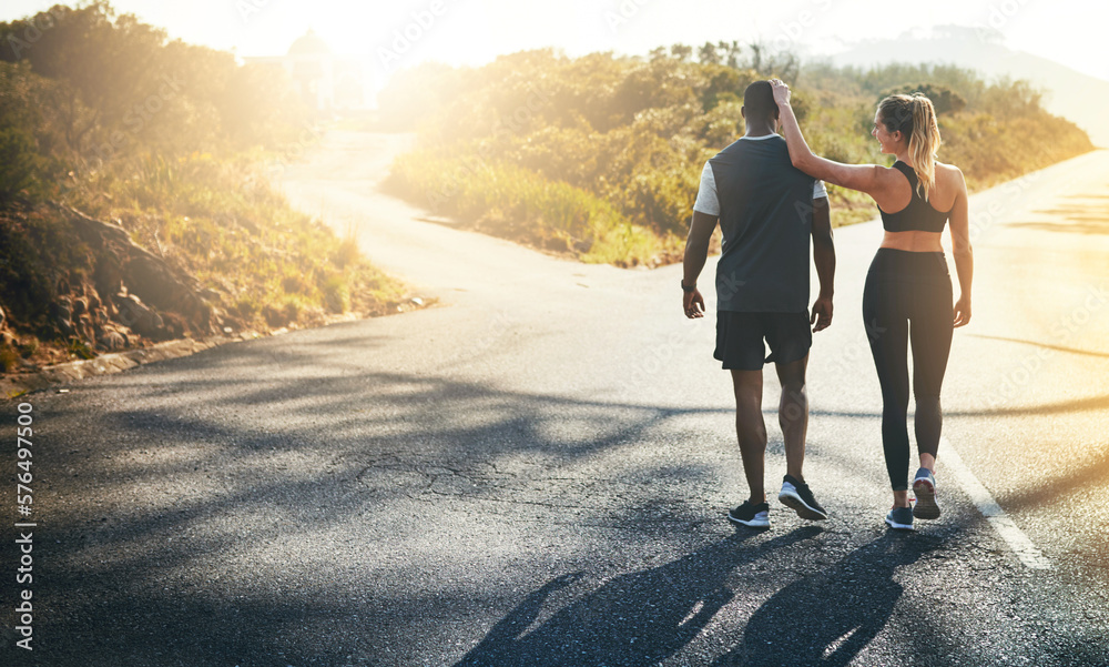 In the journey to fit as a couple. Shot of a fit young couple slowing ...
