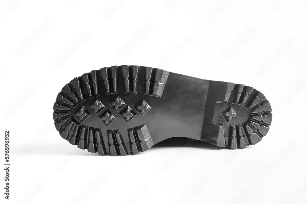 Lug sole of black combat boots on high heel platform lying on isolated ...
