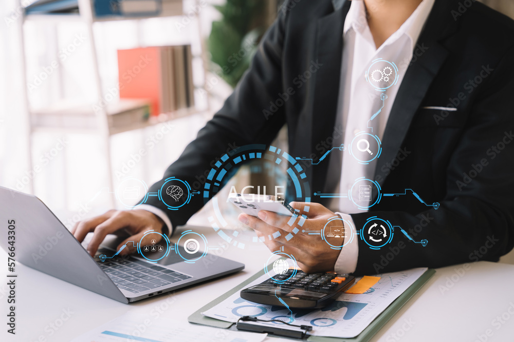 Agile development methodology concept. Business hand using laptop ...