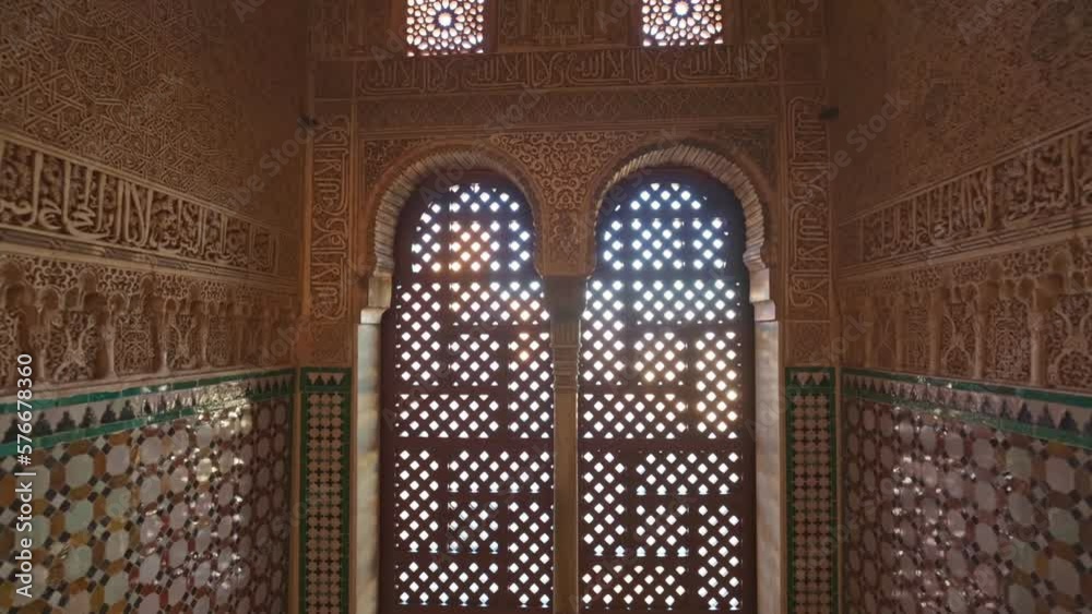 Camera moves to arches of the window between the walls with Moorish ...