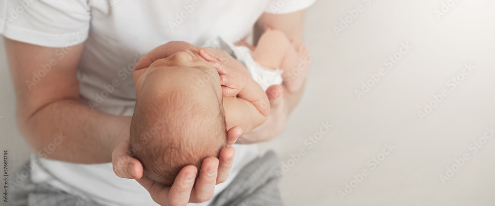 Happy Father's Day banner. Newborn 1 month old baby in father's hands ...