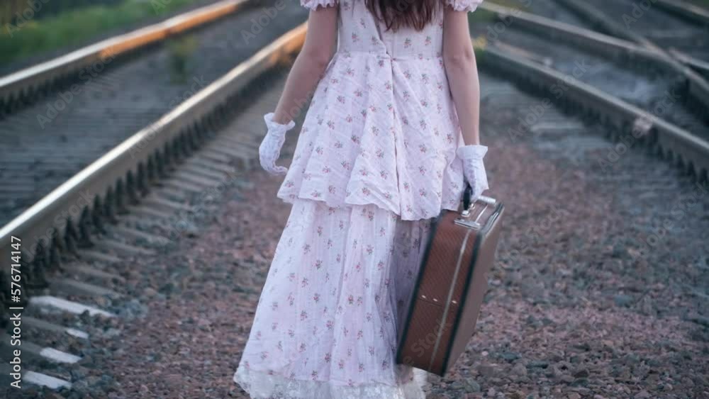Back view unrecognizable young slim woman in vintage dress with ...