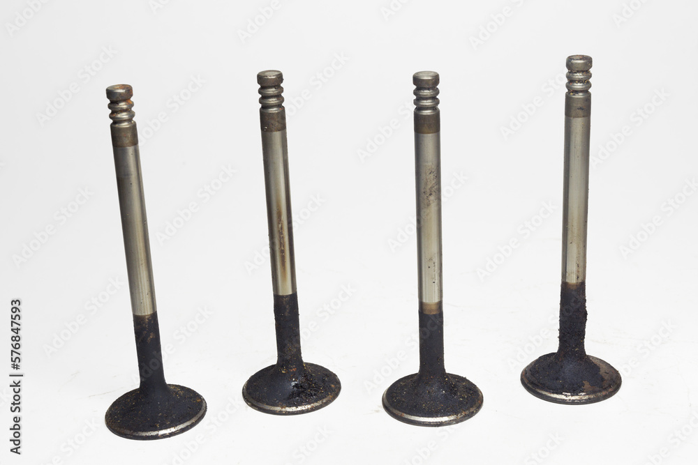 inlet poppet valves, previously used in car engine. black sludge ...