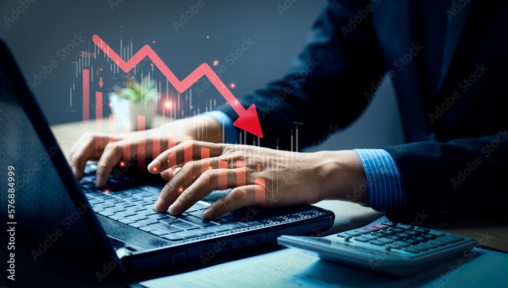 Foto de Economic collapse concept, businessman with falling financial ...