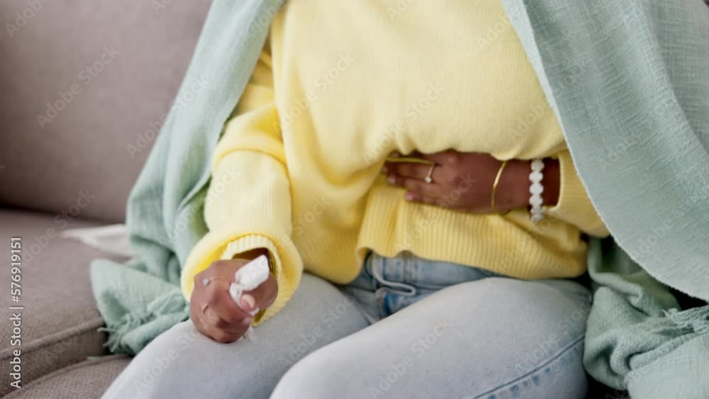 Black woman, couch and stomach with cramp, pain and rubbing for ...