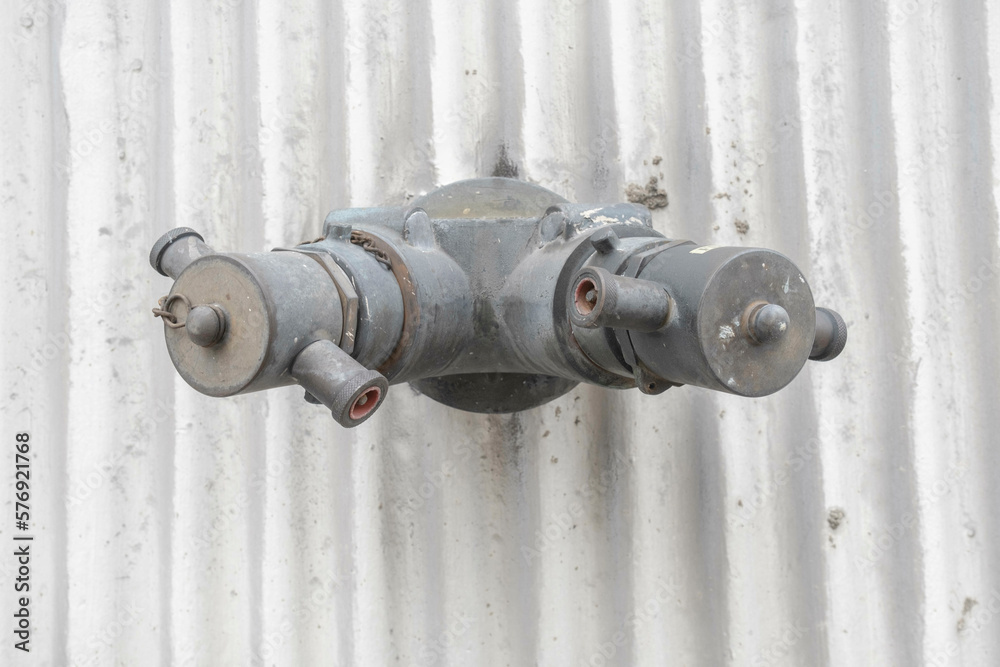 close up fire hydrant water pipe connector installed in wall for ...