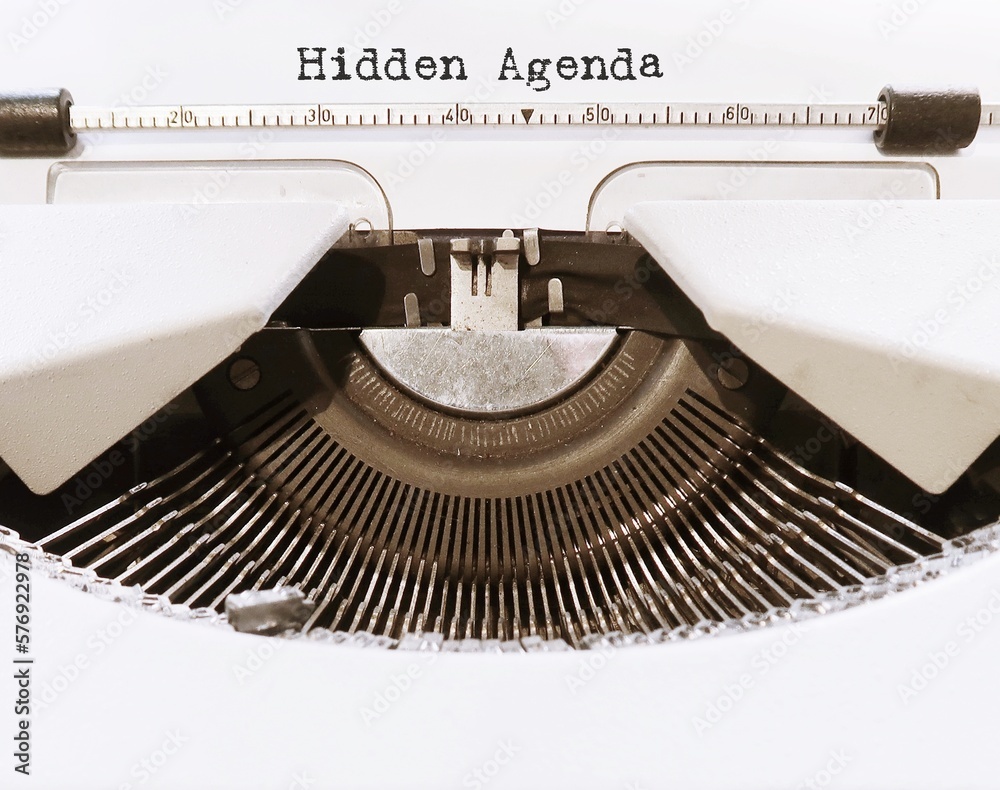Foto de Vintage classic typewriter with text typed HIDDEN AGENDA, means ...