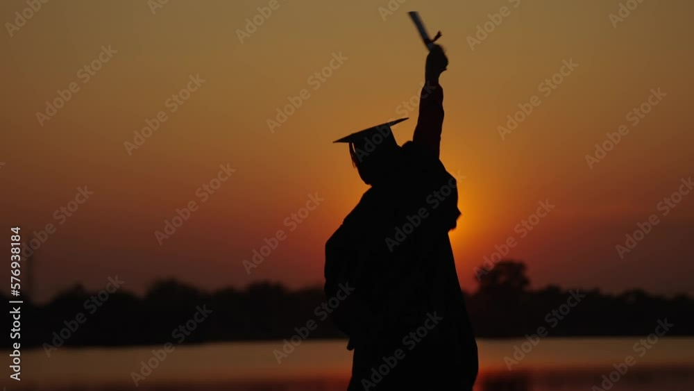Vídeo do Stock: Silhouette Sunset of Graduation Congratulations on the ...
