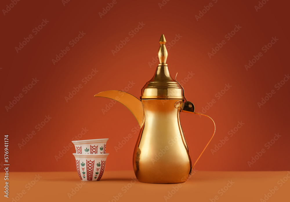 Arabian coffee with golden dallah on a dark red background, A still ...