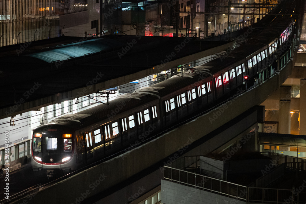 Hong Kong MTR Q-train arrive at Kwun Tong station at night Stock Photo ...