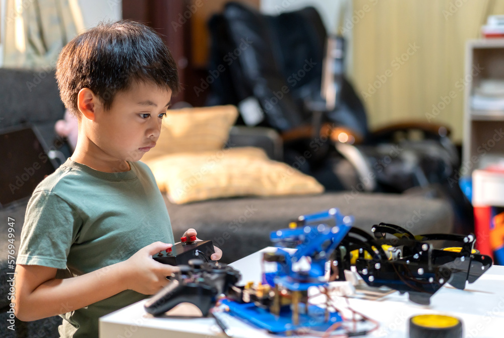 Foto de Portrait happy kid little asian boy son having fun hobby ...