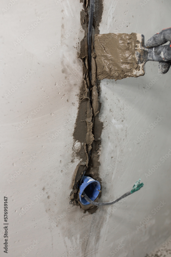 Chasing the wall for the installation of an electrical cable - the installation of an electrical ...