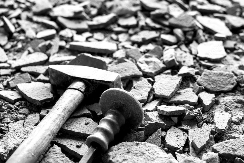 Hammer and chisel on broken concrete. Construction waste Stock Photo ...