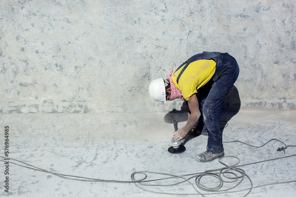 Concrete ceiling surface of the pool grinding by angle grinder Stock ...
