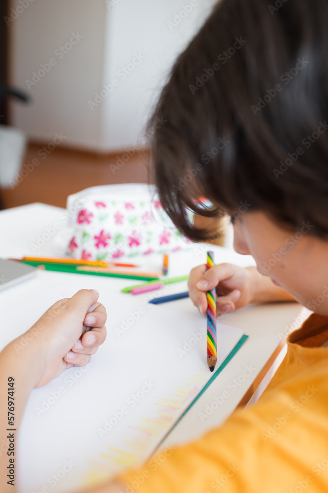 Online education. drawing lesson. a child draws a drawing in an online ...