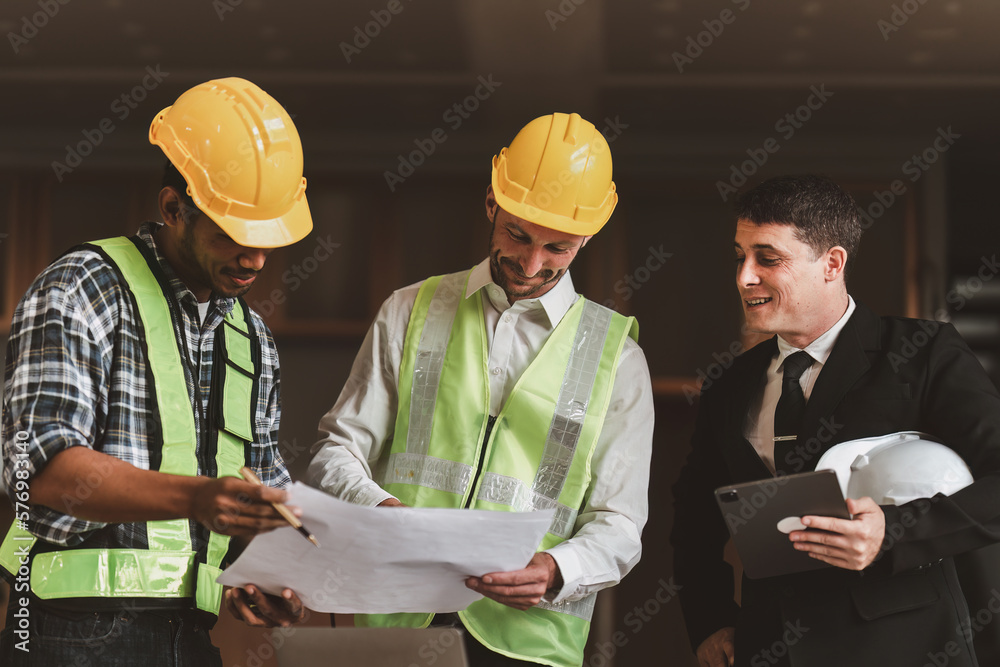 Architect team working with blueprints for architectural plan, engineer ...