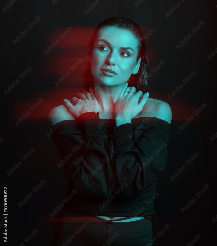 Sexy looking woman with dark clothes and wet hair portrait in red and ...