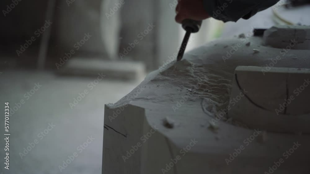Stockvideo Watch a skilled sculptor at work in their studio as they ...