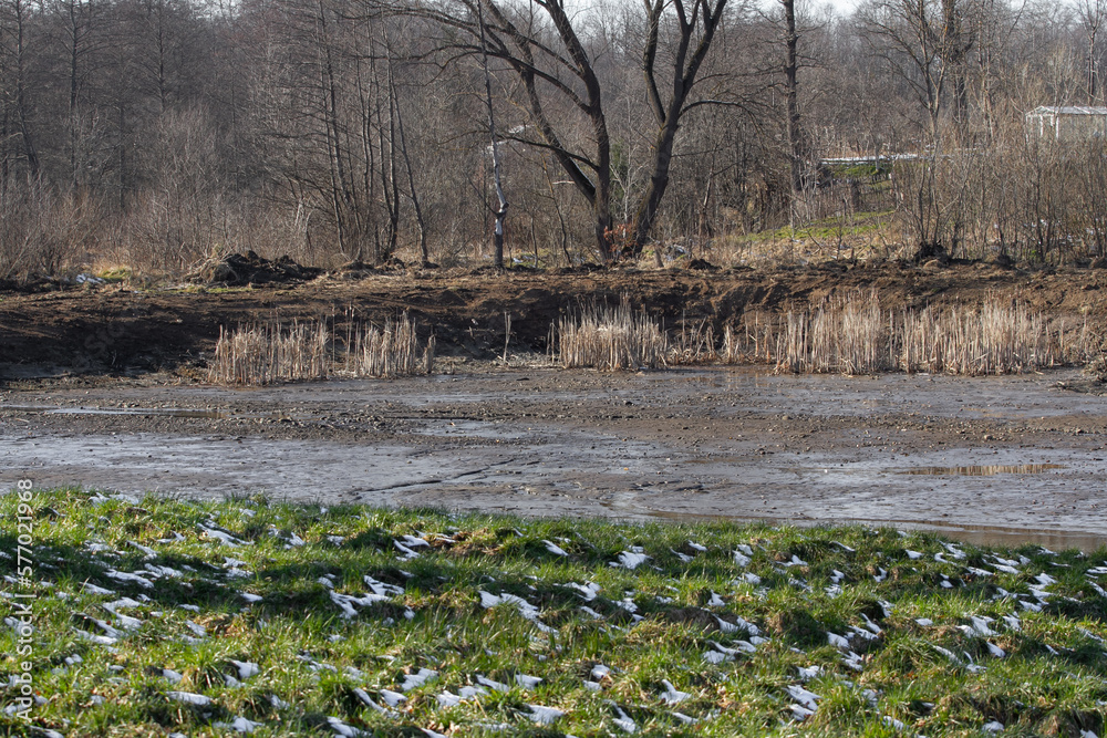 pumping out drainage of a reservoir artificially, lowering the water ...