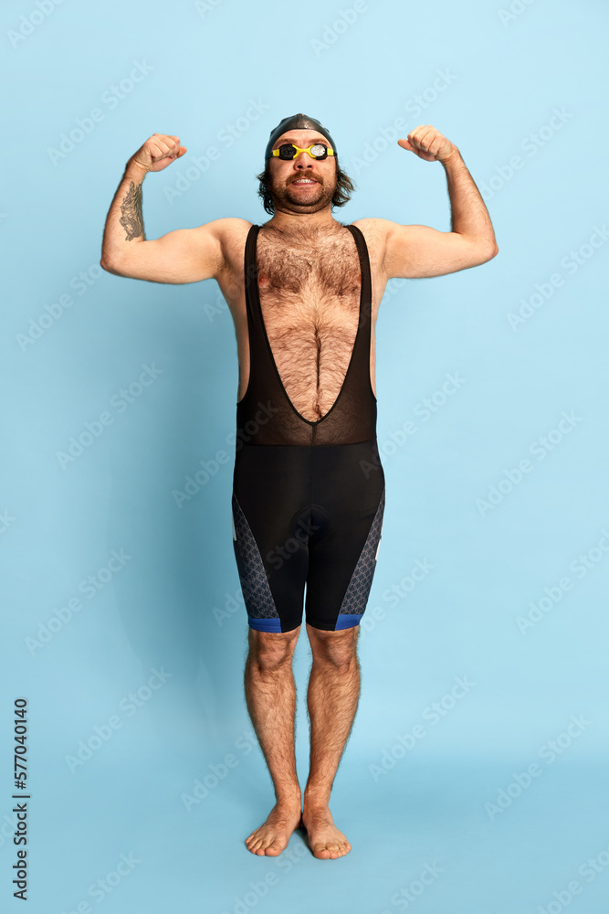 Comic portrait of funny bearded man in swimsuit and swimming cap and ...