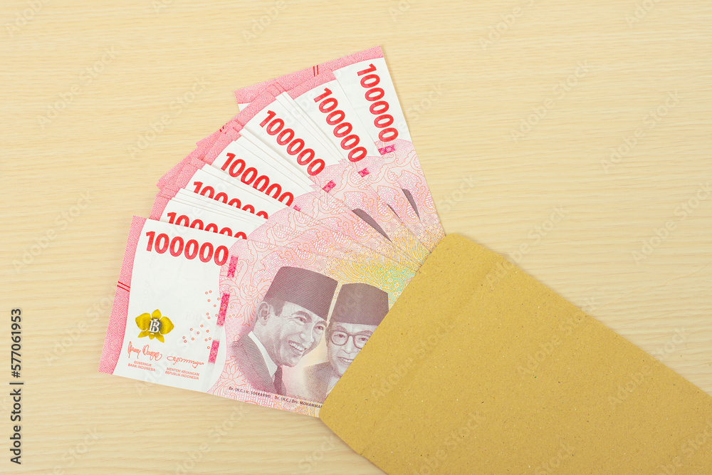 Cash payment concept. Indonesian rupiah currency (Rp. 100.000 Seratus ...