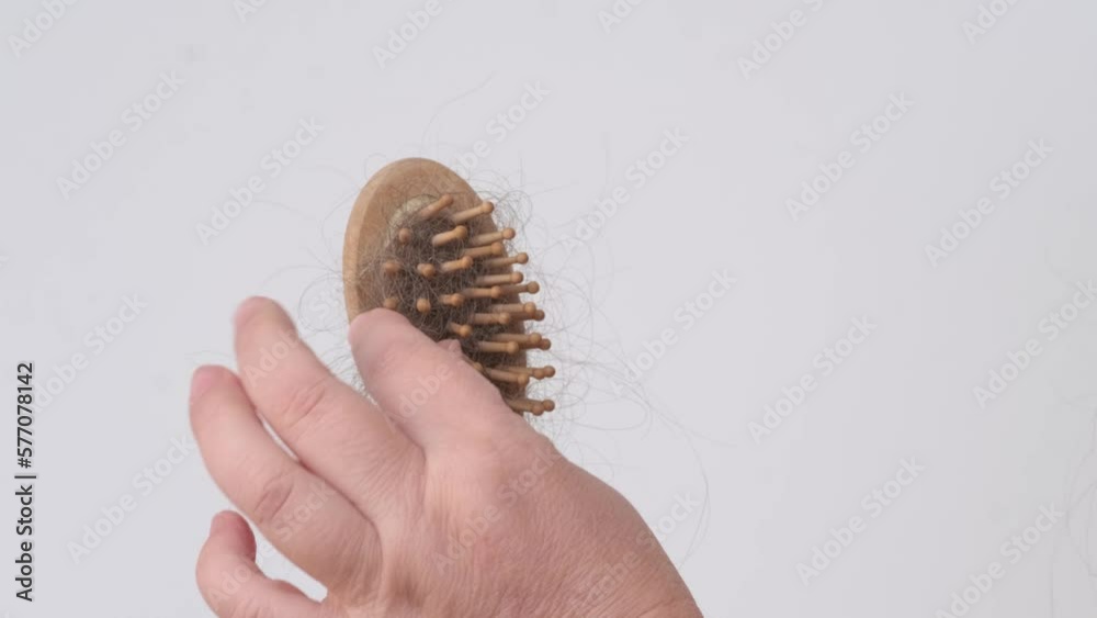 wooden comb, brush, tool for daily hygiene, combing in female hand ...