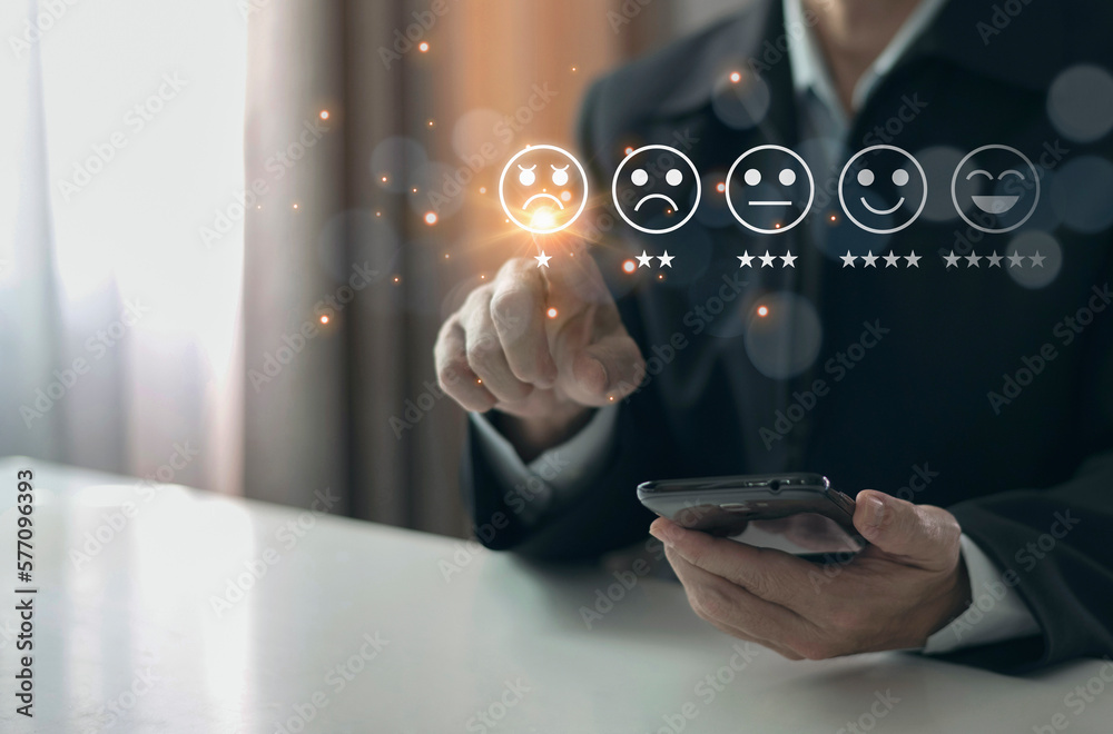 Unhappy Client hand pressed the smile face emoticon on the virtual ...