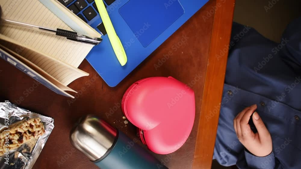 Vertical video of office woman opening a heart -shaped lunch container ...