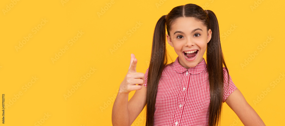 Happy girl child point finger gun hand gesture yellow background ...