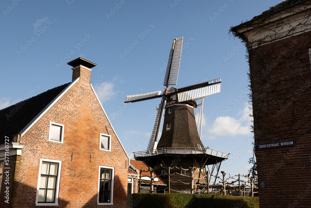 typical Dutch grain mill windmill in Winsum Holland. De Vriendschap is ...