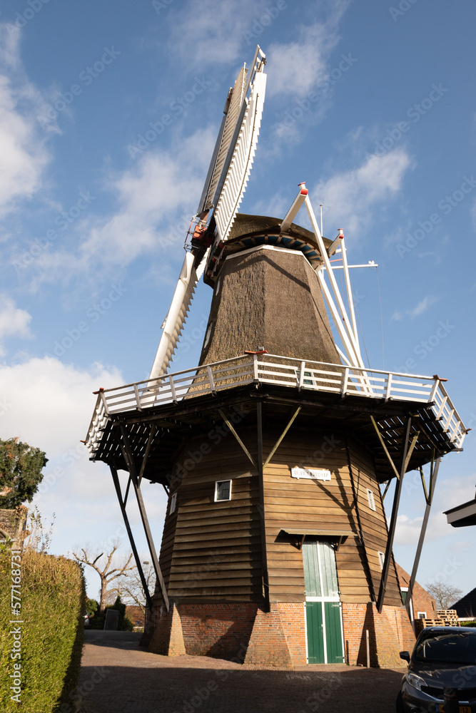typical Dutch grain mill windmill in Winsum Holland. De Vriendschap is ...