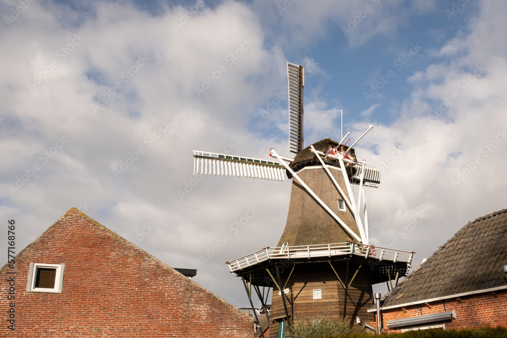typical Dutch grain mill windmill in Winsum Holland. De Vriendschap is ...