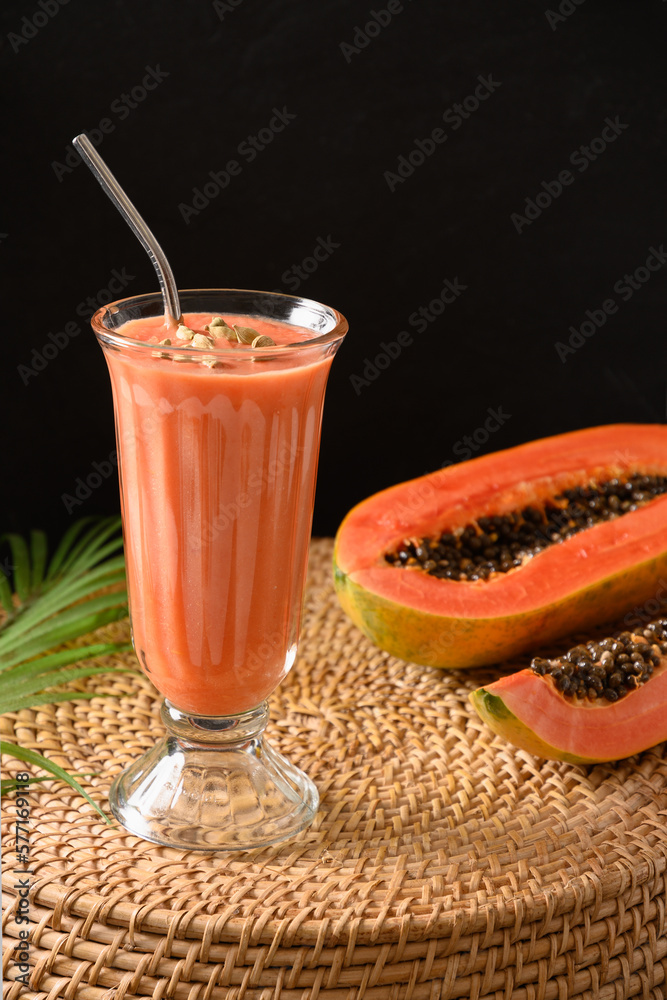 Asian traditional papaya lassi on dark background. Freshness cold ...
